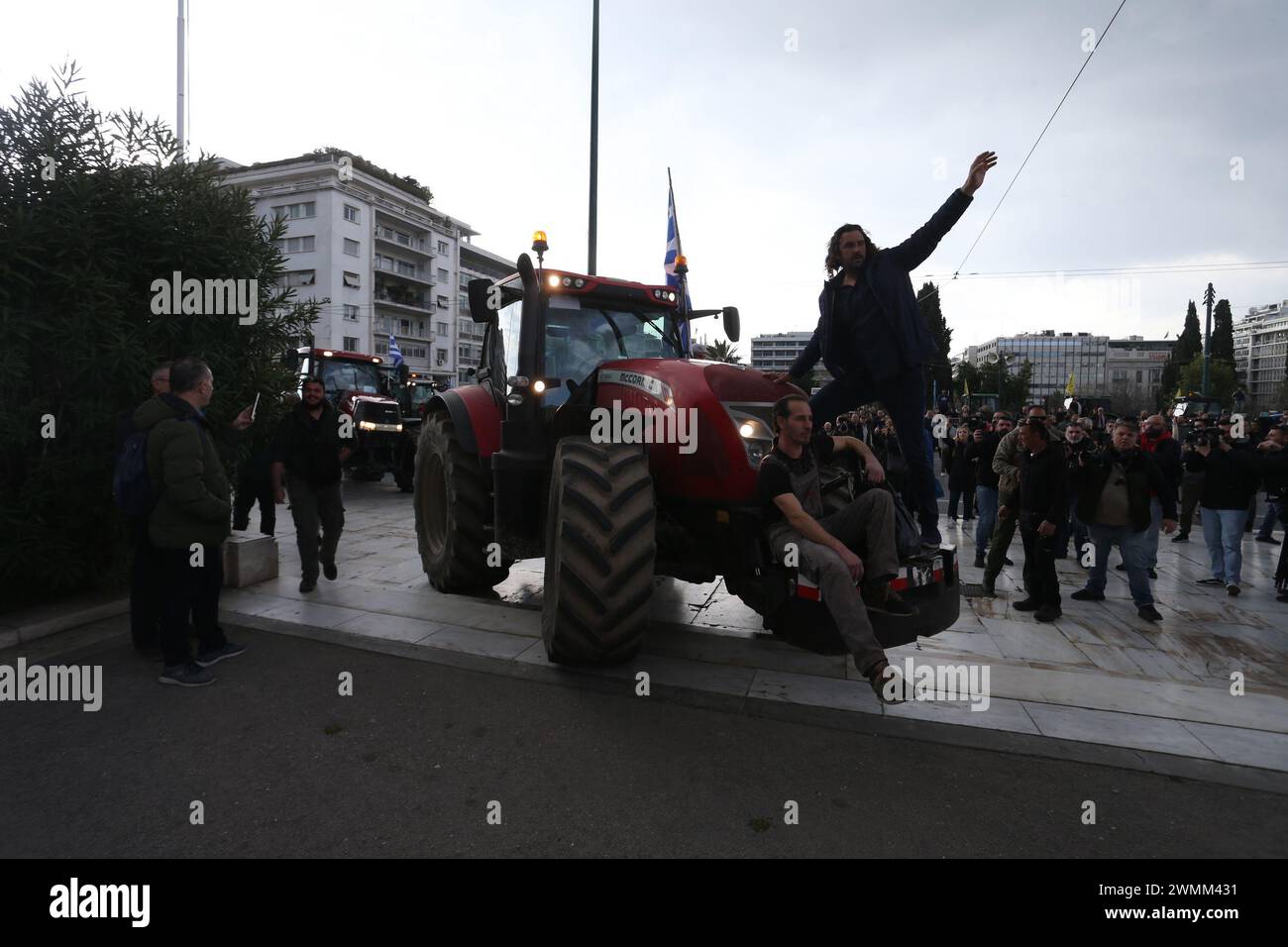 Greek farmers protest outside the Greek Parliament with their tractors ...