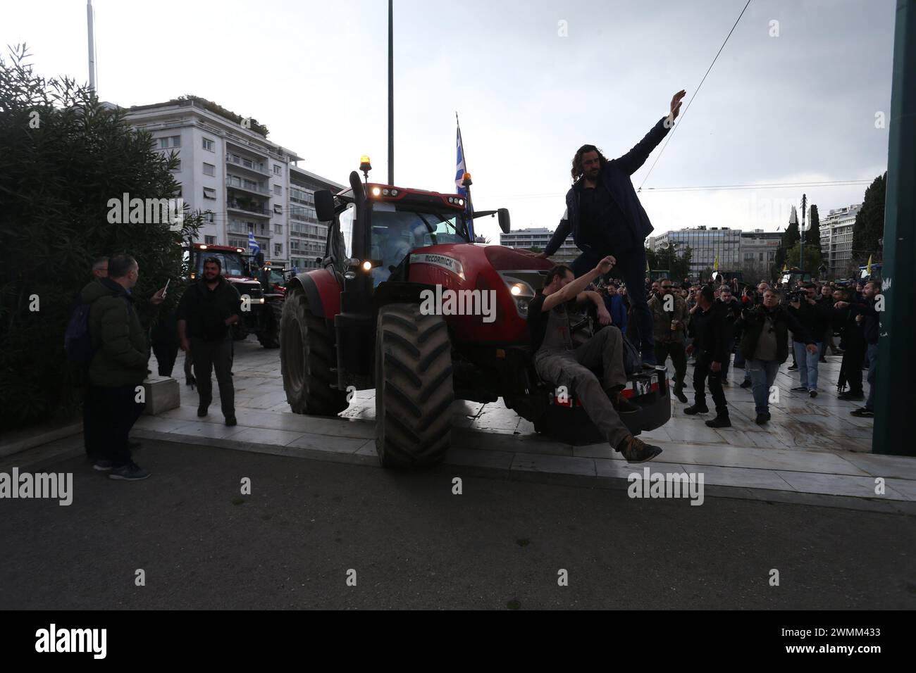 Greek farmers protest outside the Greek Parliament with their tractors ...