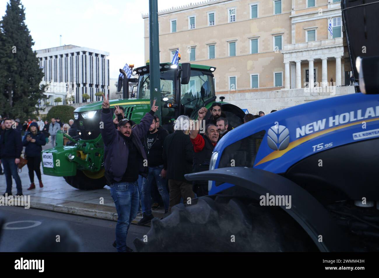 Greek farmers protest outside the Greek Parliament with their tractors ...