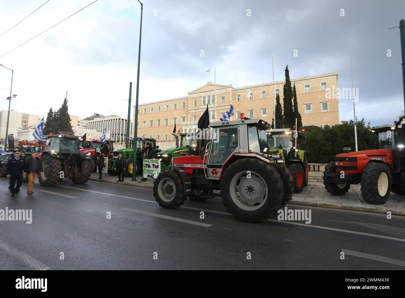 Greek farmers protest outside the Greek Parliament with their tractors ...