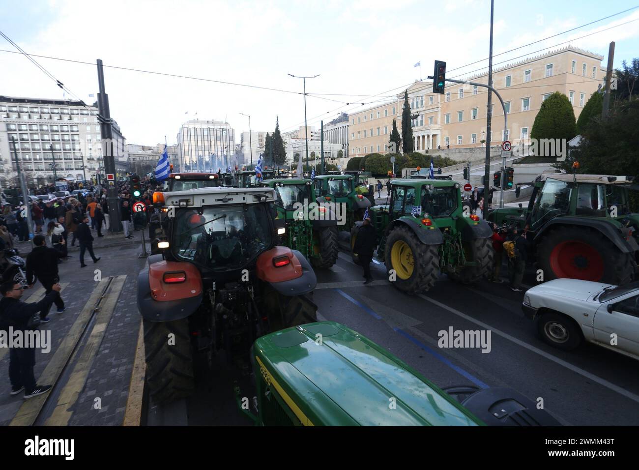 Greek farmers protest outside the Greek Parliament with their tractors ...