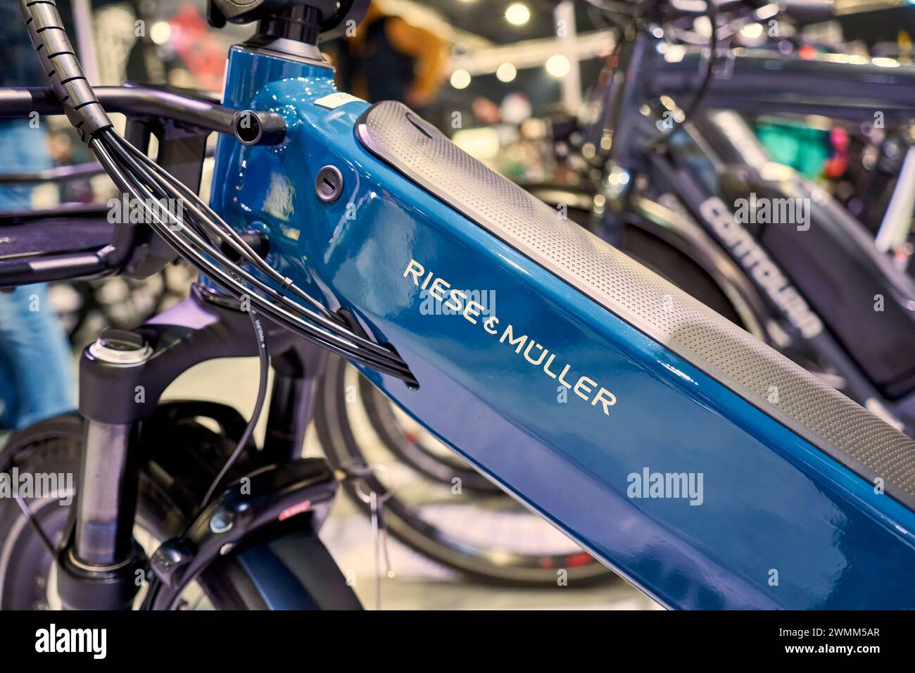 Riese und Muller logo on the blue frame of a luxury electric bike in ...