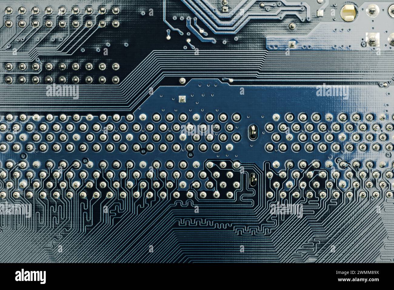 circuit board connections. back side of computer mother board. high ...