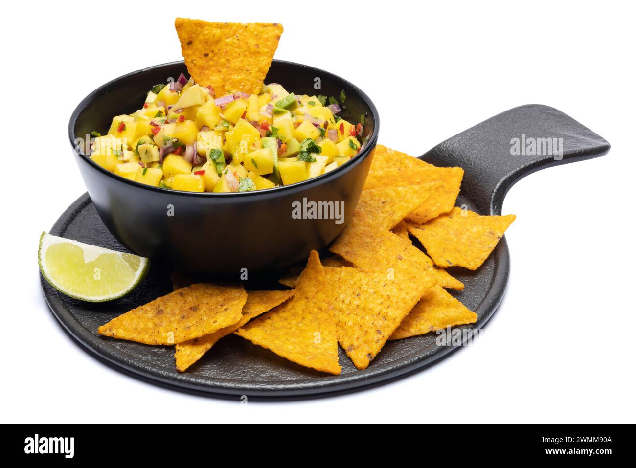 Freshly made mango salsa in a black ceramic bowl Stock Photo - Alamy