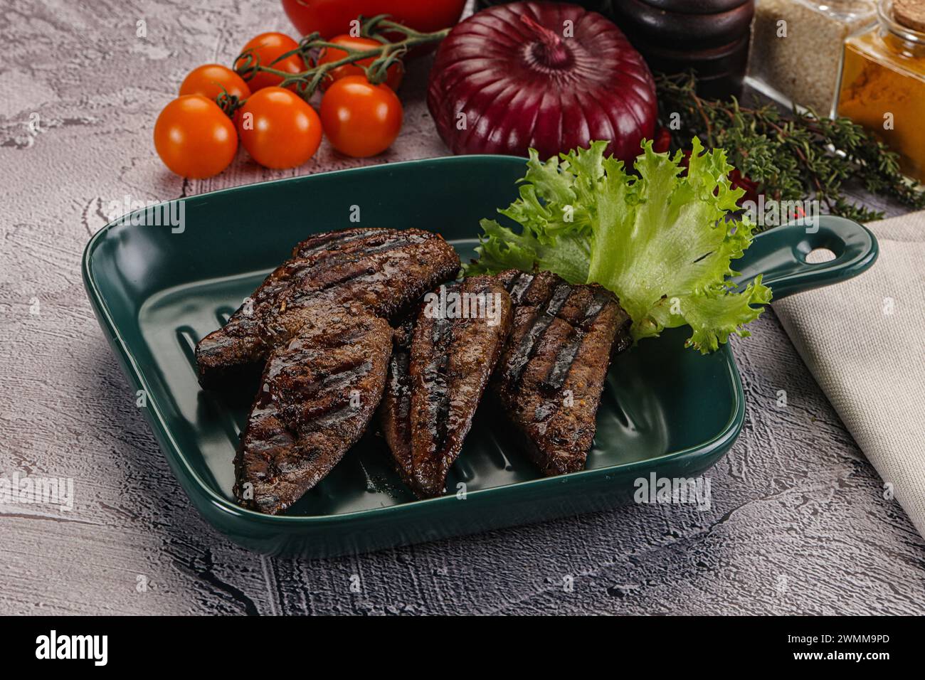 Grilled diet beef liver steak in the plate Stock Photo - Alamy