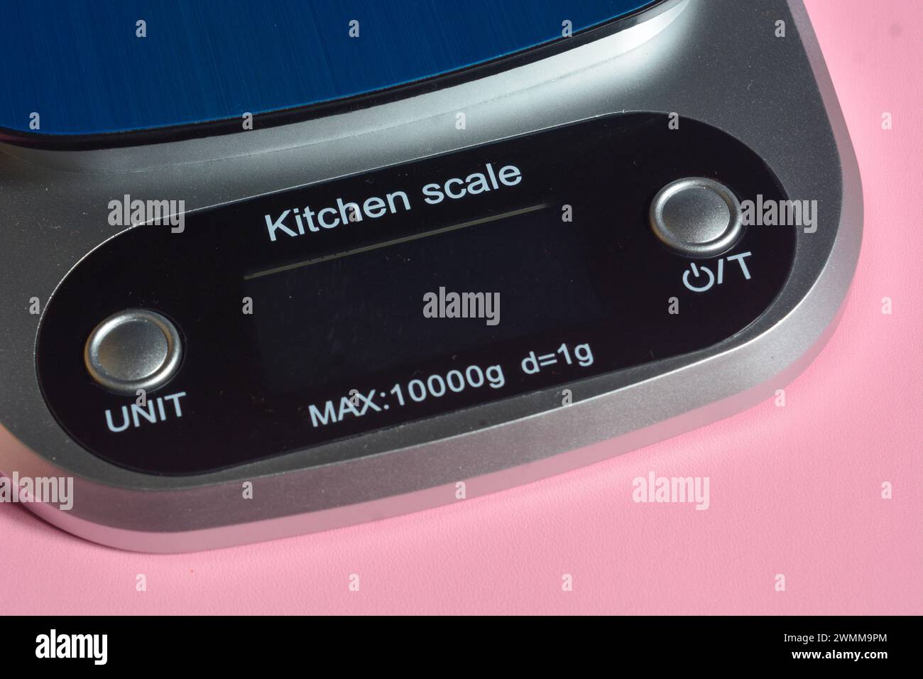 Digital scales that are weighing chocolate, strawberries and several ...