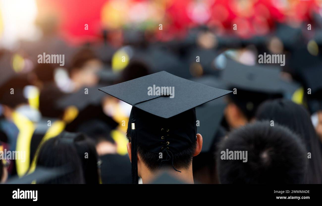 Back view of graduates during commencement Stock Photo - Alamy