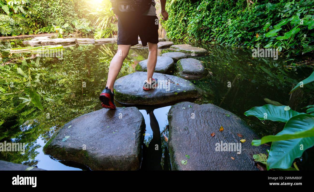 Backpacker crossing river on bridge hi-res stock photography and images ...