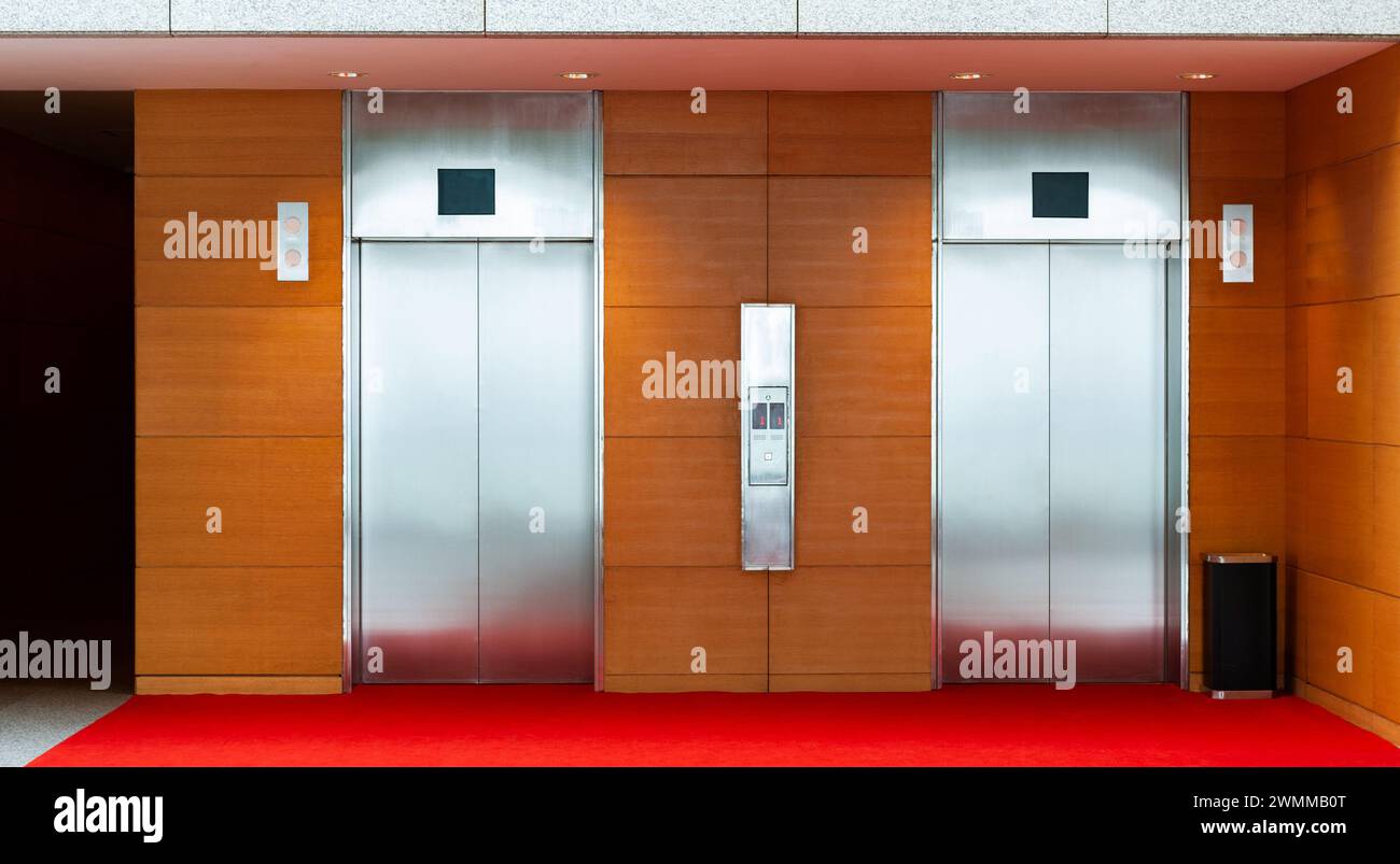 Two elevator doors in luxurious building Stock Photo - Alamy