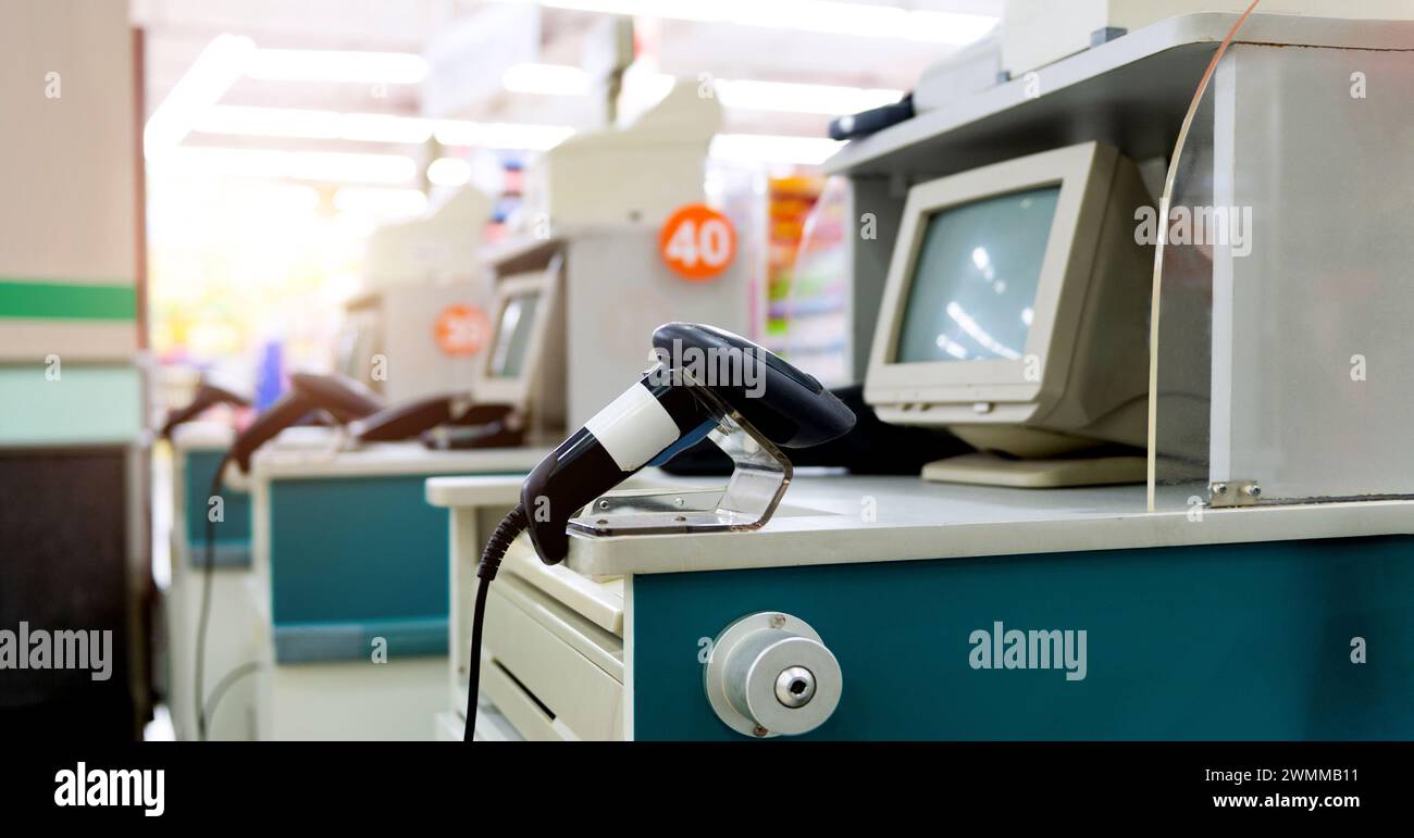 Empty checkout counter with terminal in supermarket Stock Photo - Alamy
