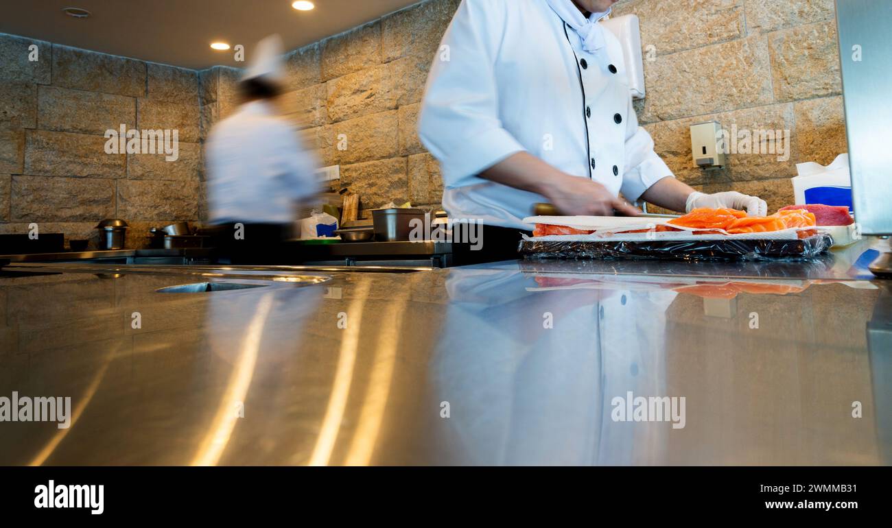 Japanese chef making sashimi in the kitchen Stock Photo - Alamy