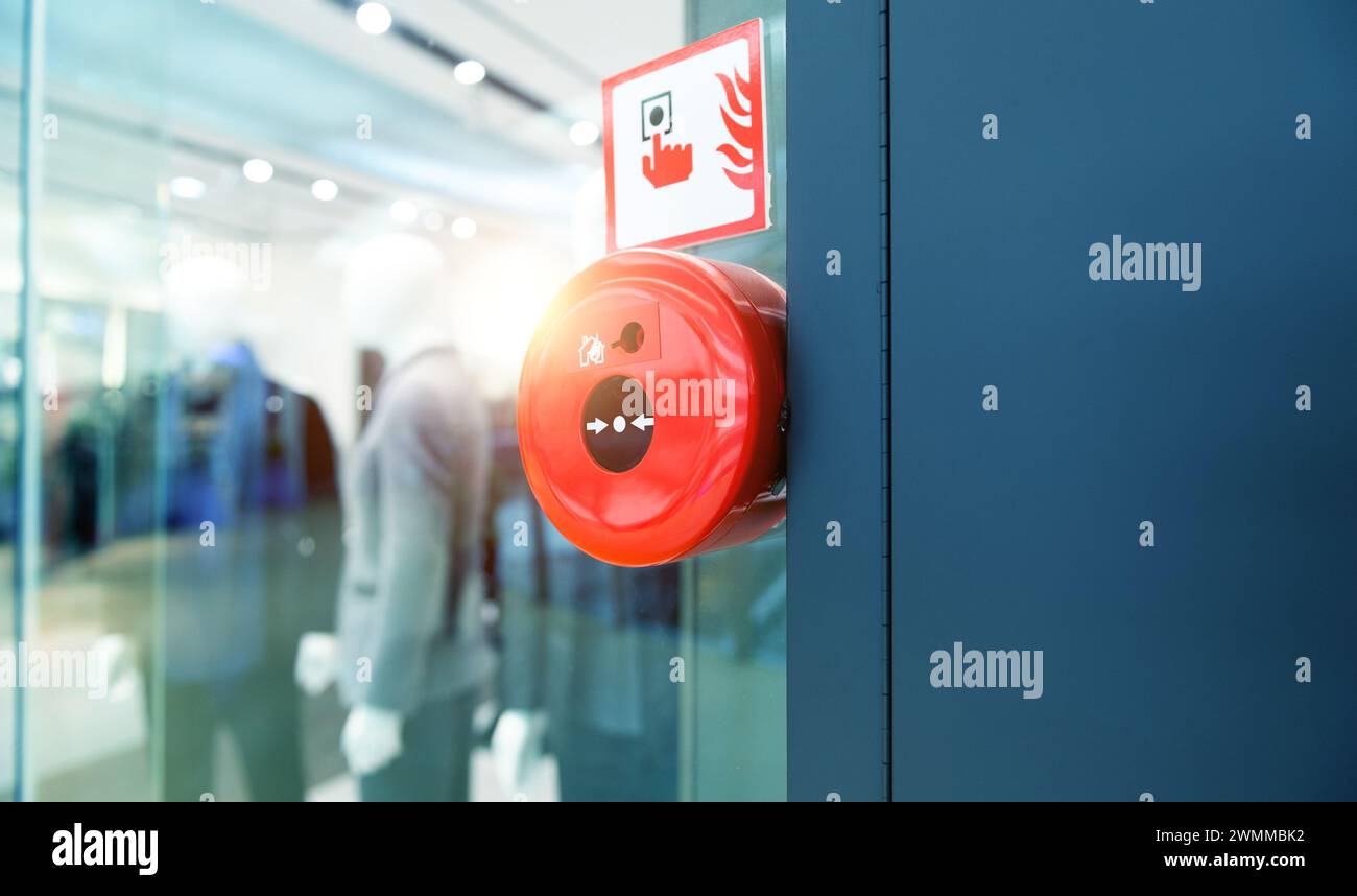 Manual push station of fire alarm system, installed on the wall of ...