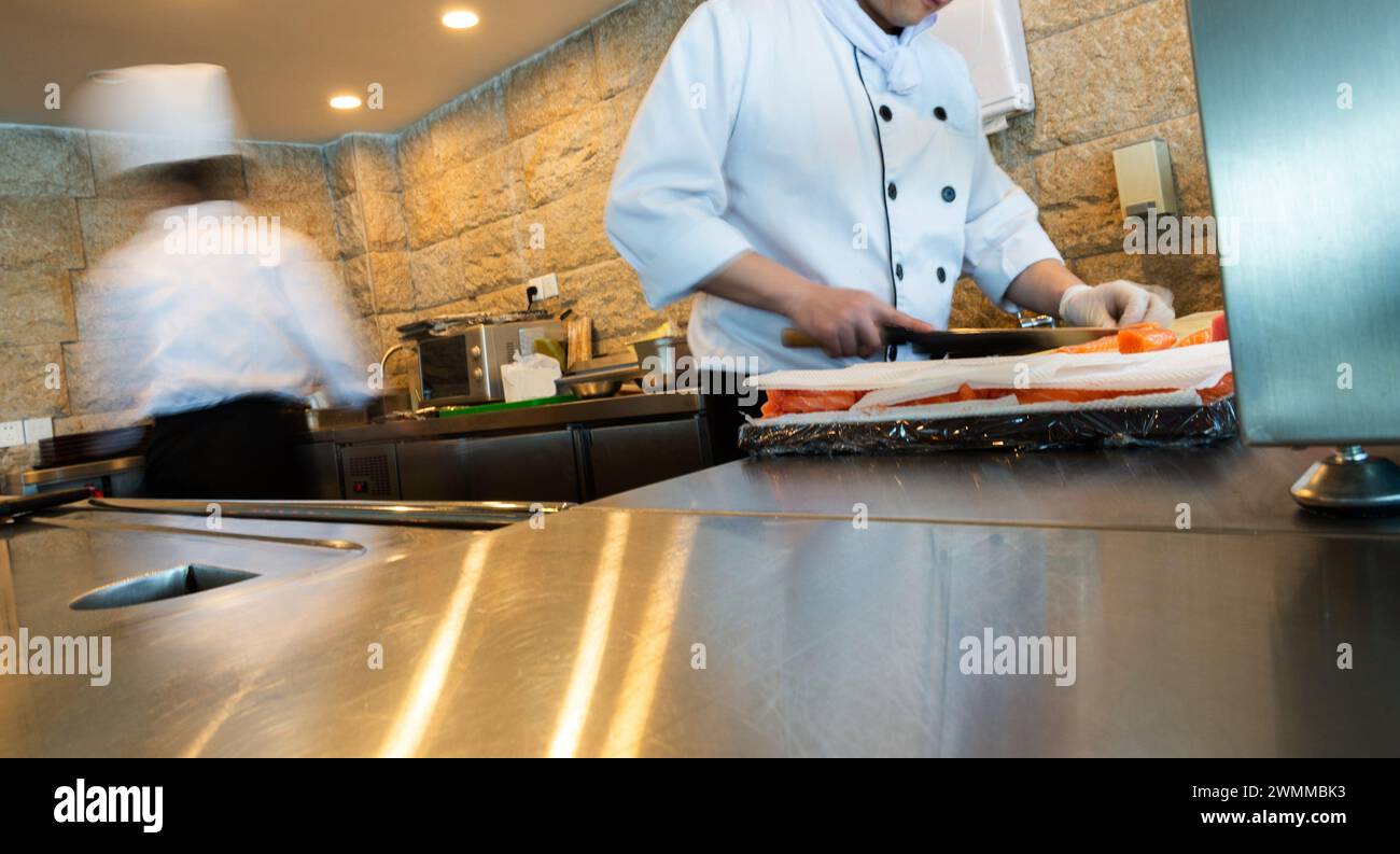 Japanese chef making sashimi in the kitchen Stock Photo - Alamy