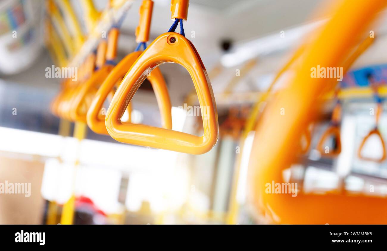 Interior bus yellow handrail hi-res stock photography and images - Alamy