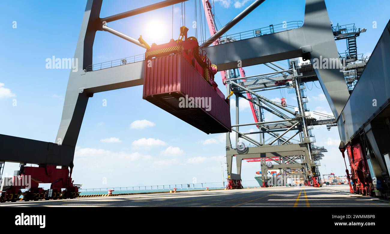 Crane unloading container in the port Stock Photo - Alamy