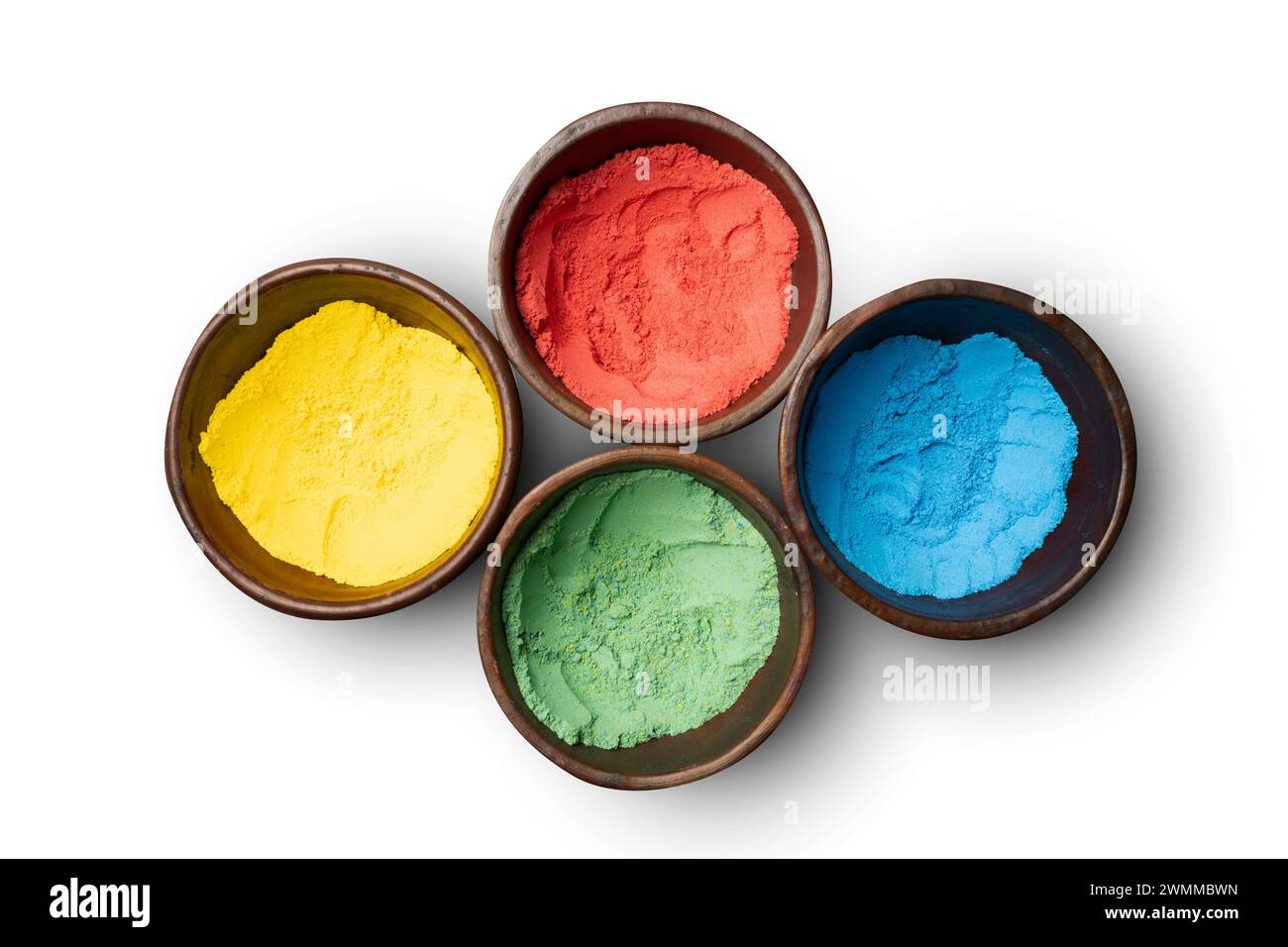 Top view of colorful traditional holi powder in bowls isolated on white ...