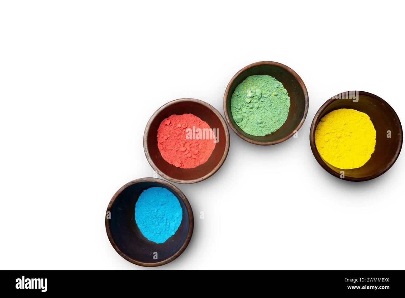 Top view of colorful traditional holi powder in bowls isolated on white ...