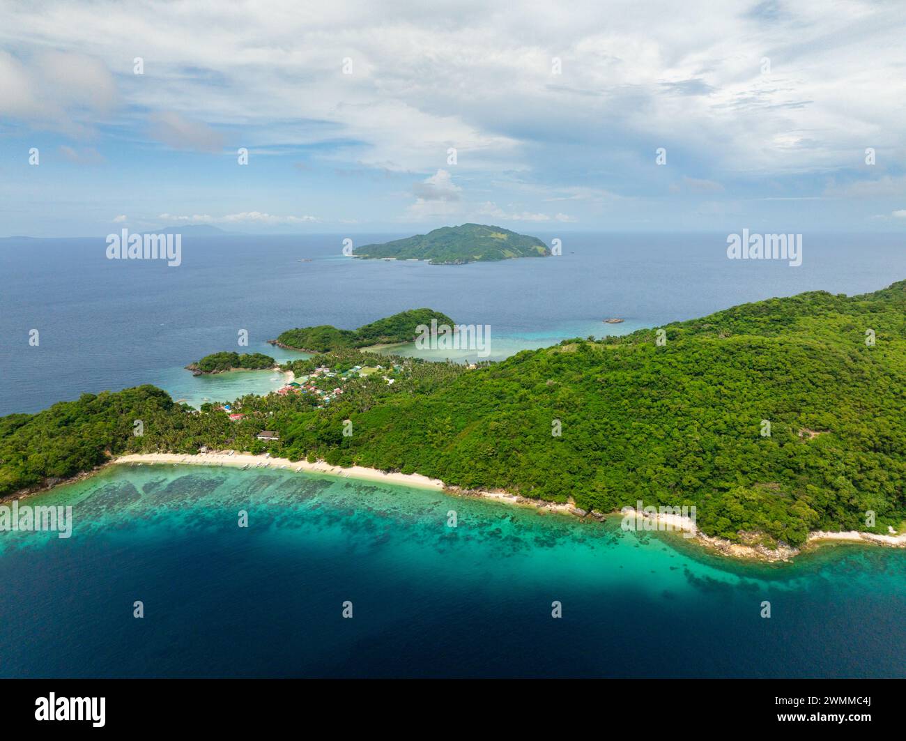 Aerial view of fishing boats over white sand beach in Alad Island ...