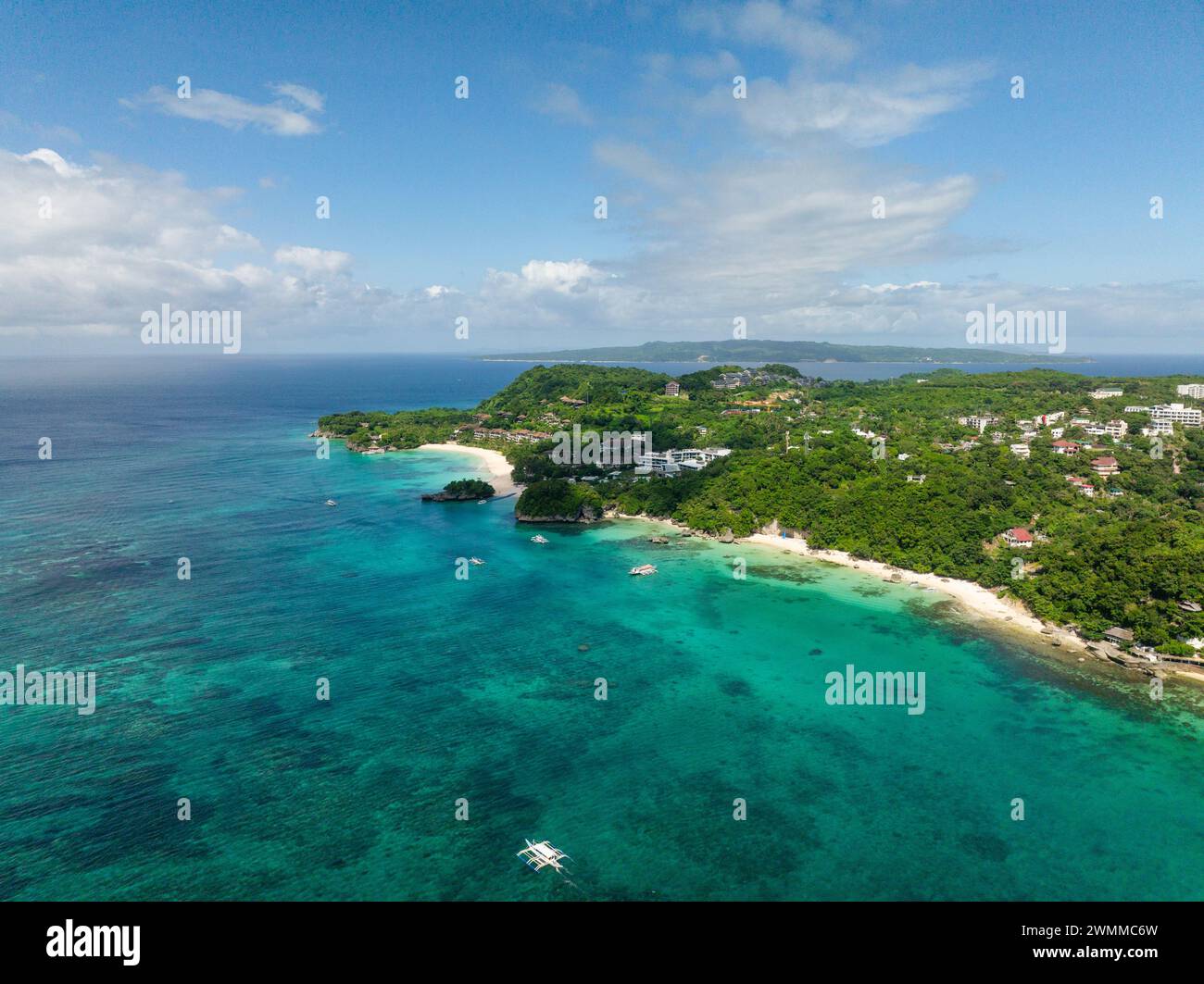 Clear calm sea water with boats under blue sky and clouds. Beaches in ...