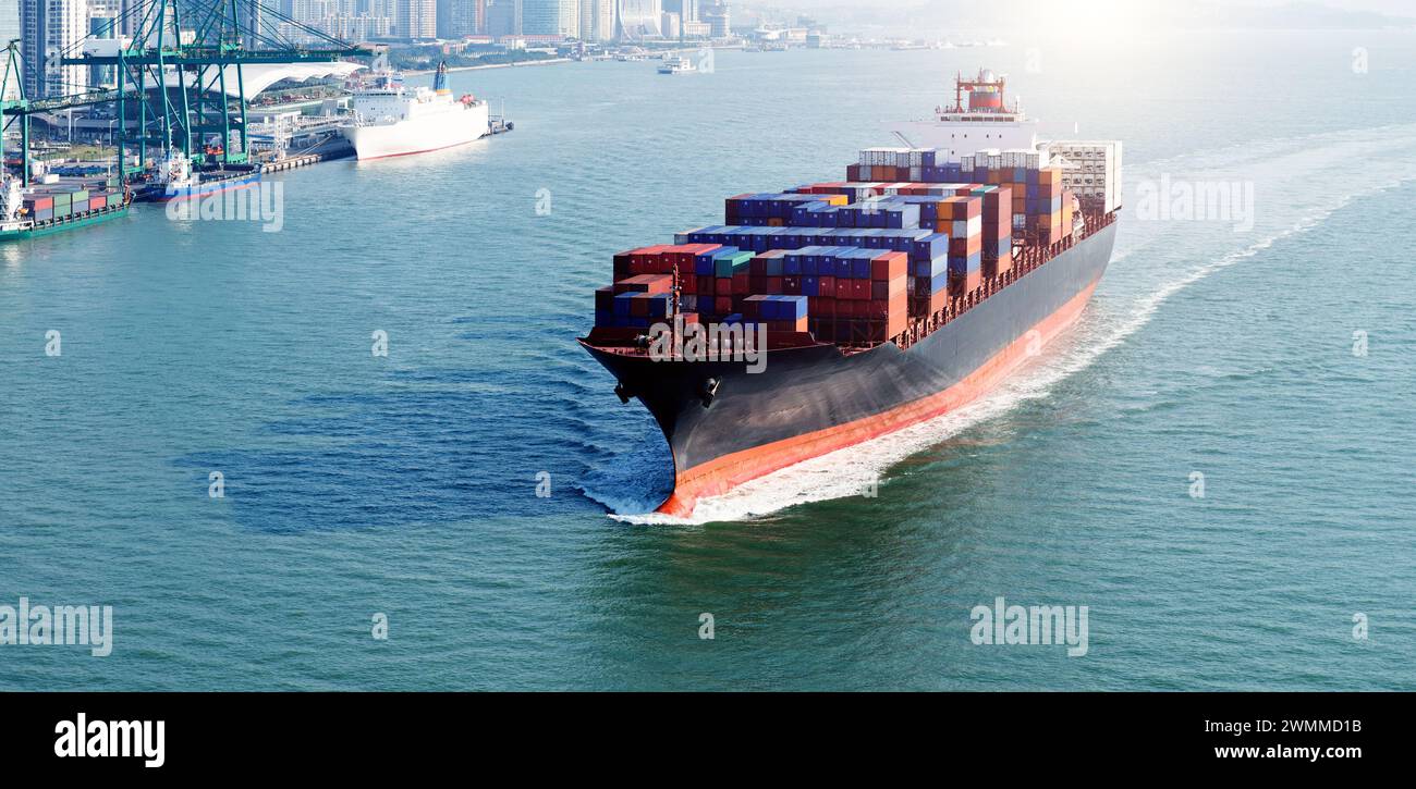 Large cargo container ship arriving in port Stock Photo - Alamy