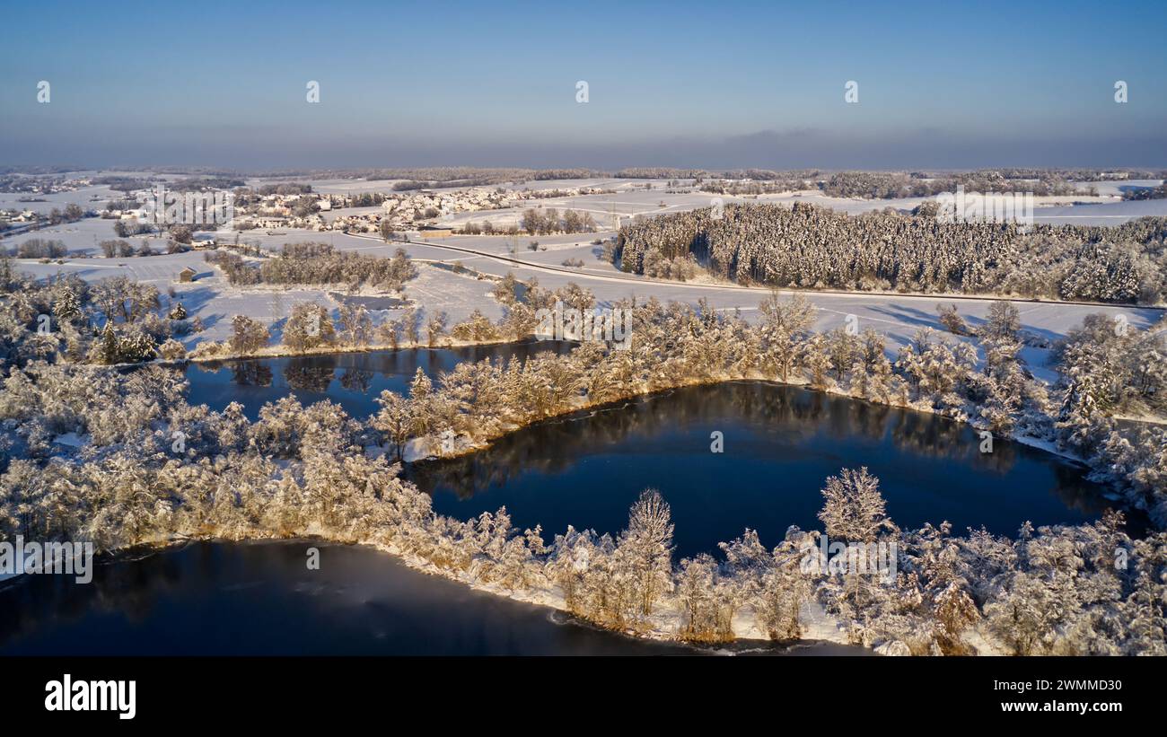 An aerial view of vast lakes amid snowy rural landscapes Stock Photo ...