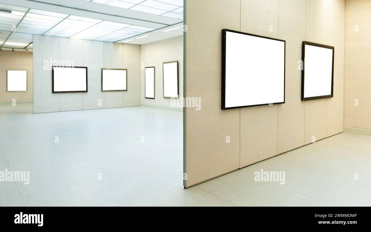 Gallery interior with many empty frame on wall Stock Photo - Alamy