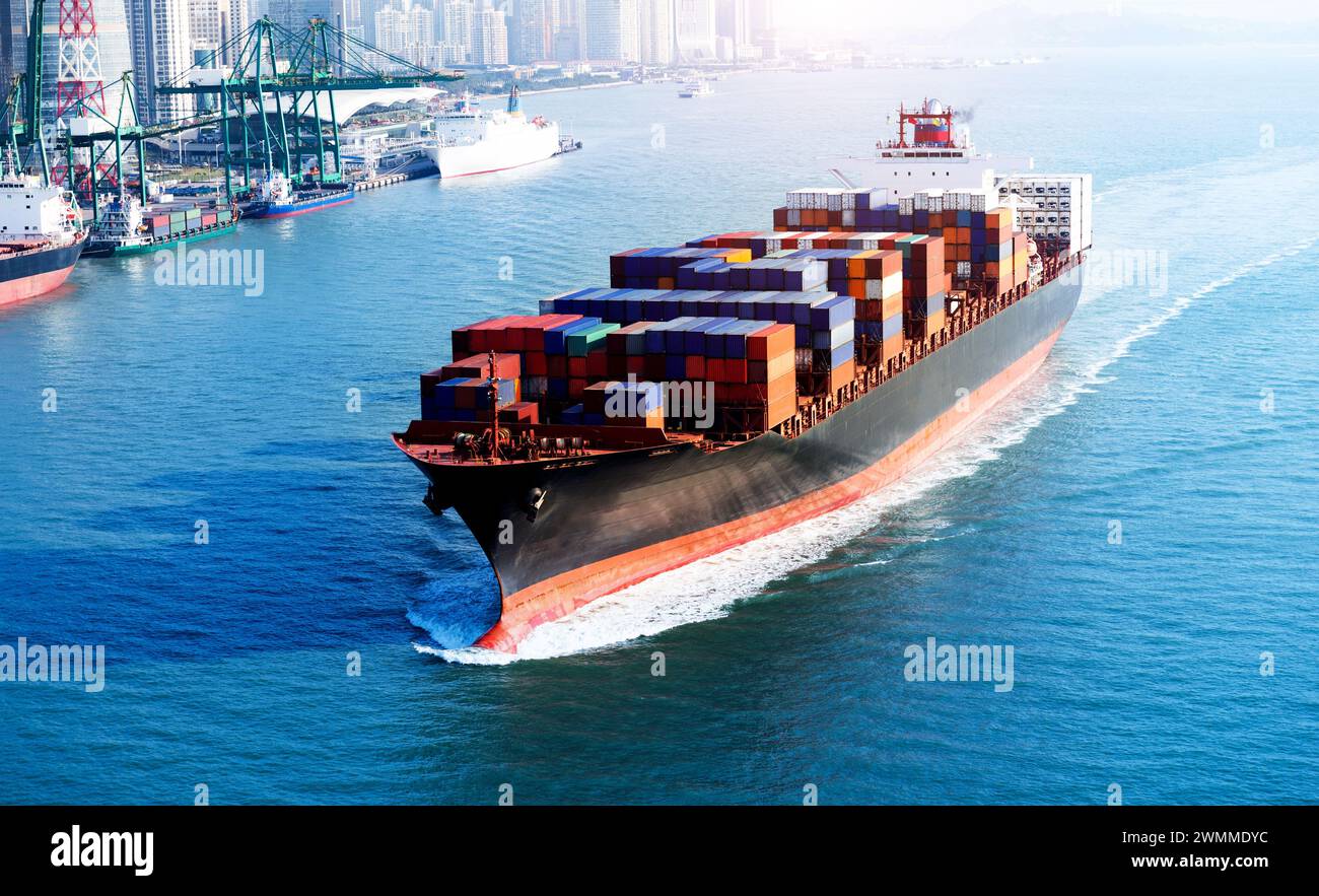 Large cargo container ship arriving in port Stock Photo - Alamy