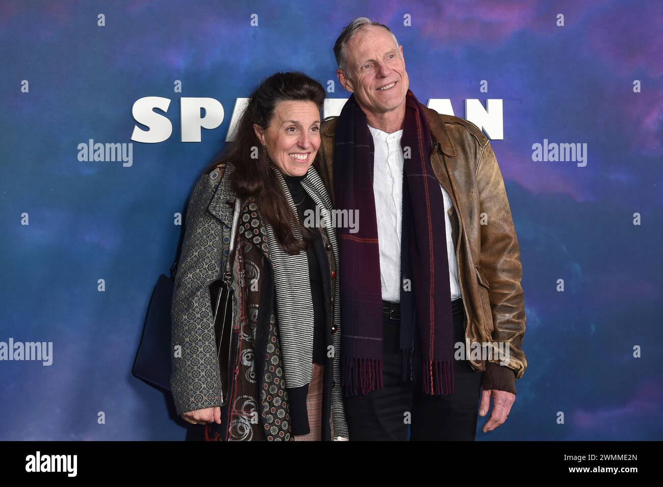Anne Flanders, left, and John Flanders arrive at the premiere of ...