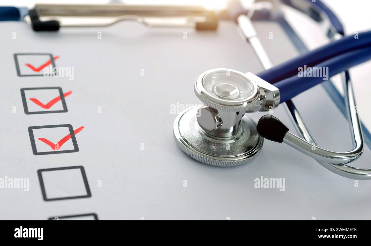 Medical clipboard with checklist and stethoscope Stock Photo - Alamy