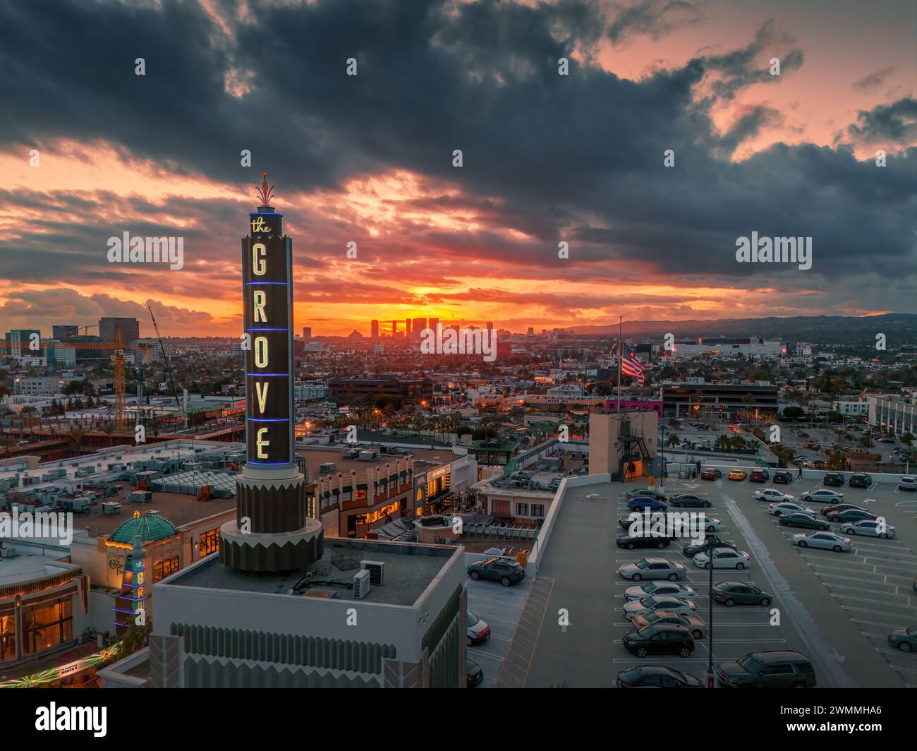 LOS ANGELES - February 2024: The Grove logo at sunset over LA skyline ...