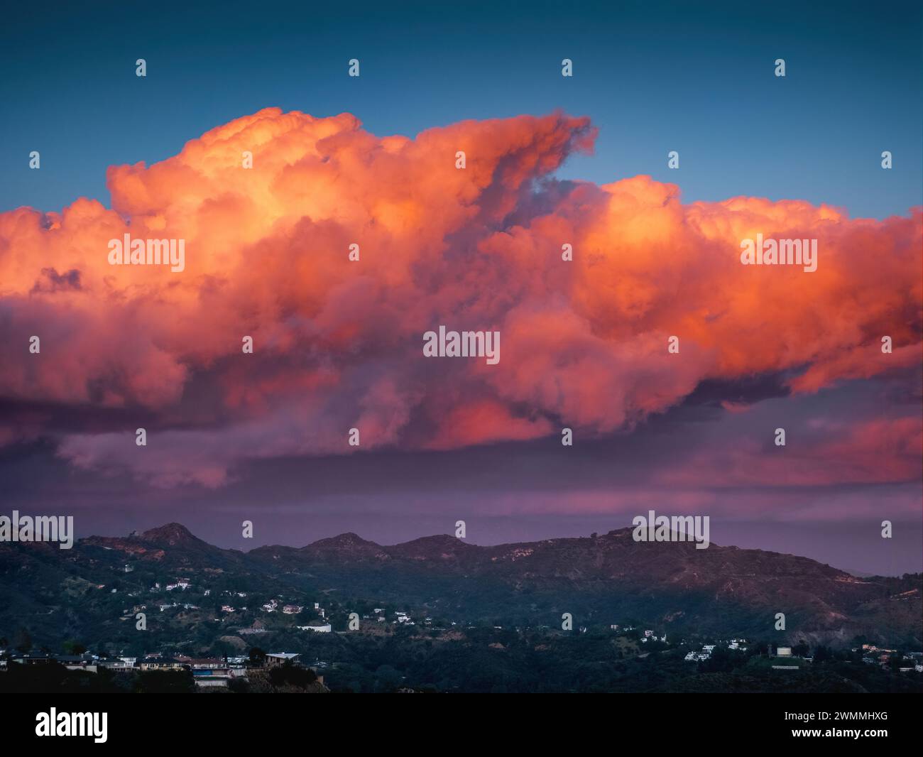 Epic red sunset clouds over Hollywood Hills mountains background Stock ...