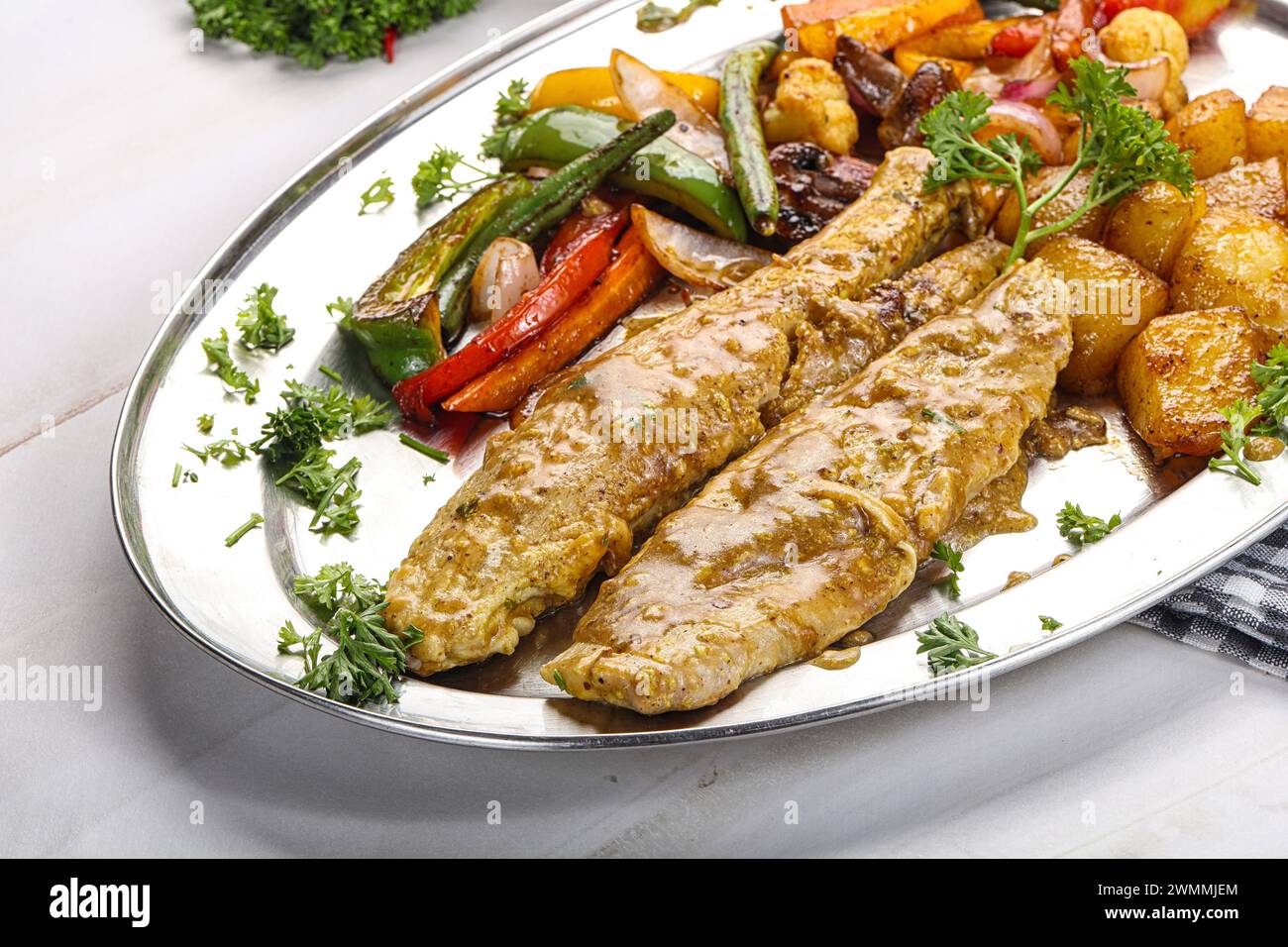 Roasted shark steak with potato and vegetable garnish Stock Photo - Alamy