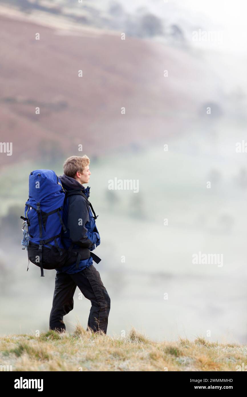 UK, Derbyshire, Mam Tor, the Great Ridge, hill walker admiring misty ...