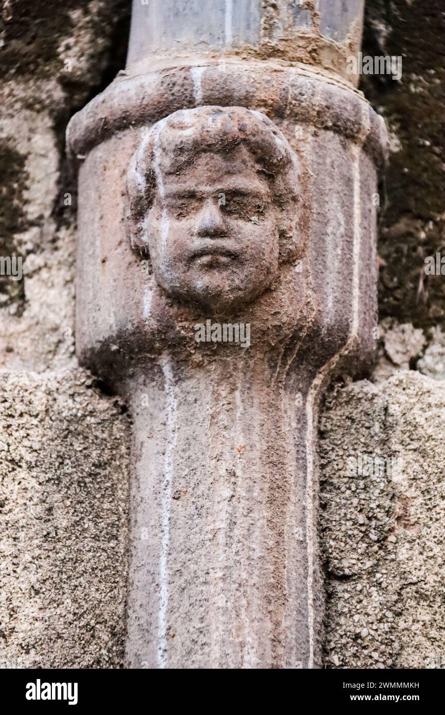 Face on old forged metal gutter in Alcoy city, Alicante. Modernist ...