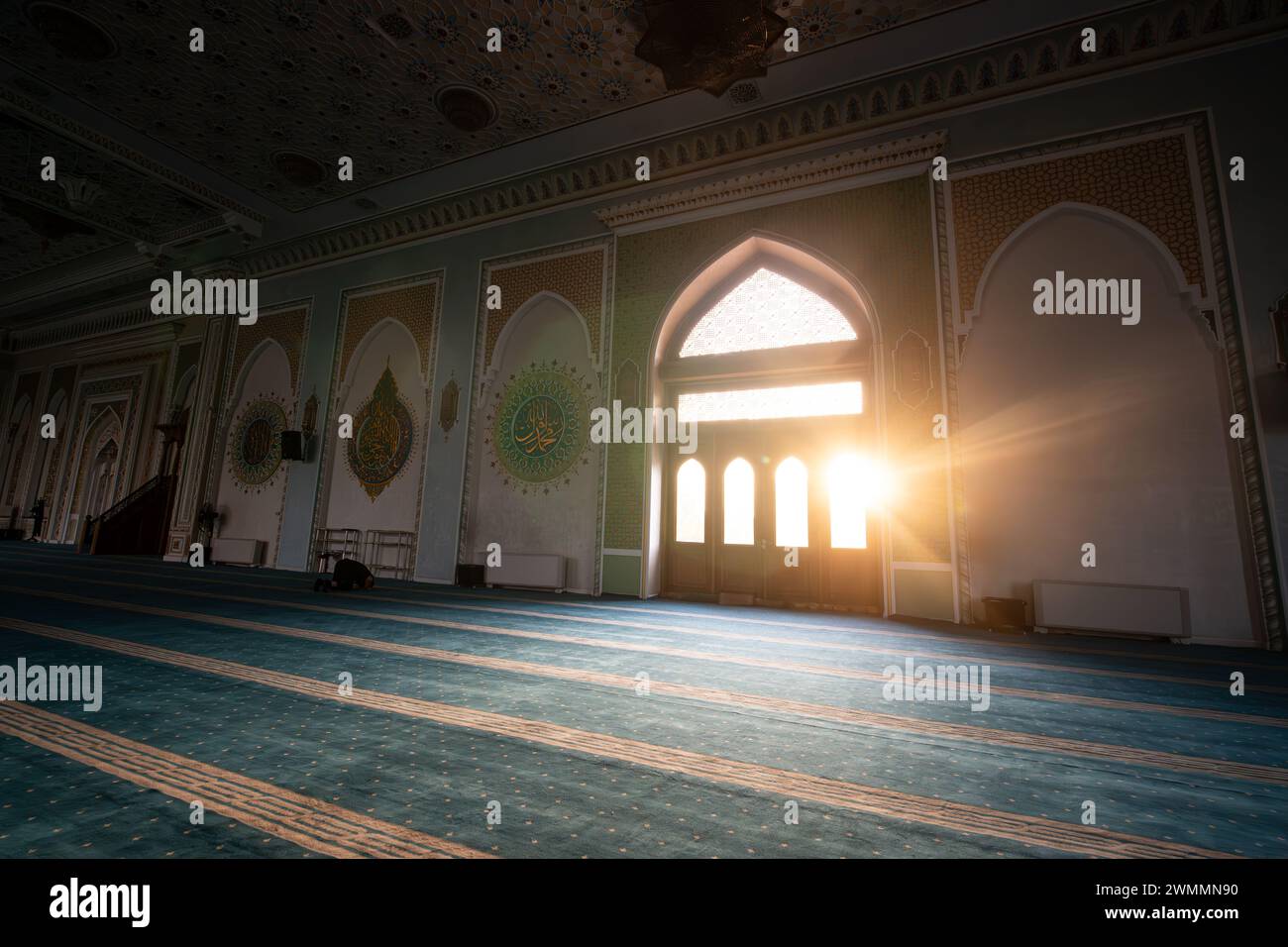 Interior of Hazrati Imam mosque with blue traditional carpet. inside ...
