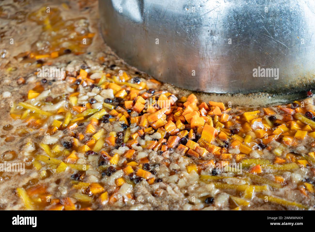 Hot pilaf in large cauldron outdoors. Traditional oriental food. Street ...