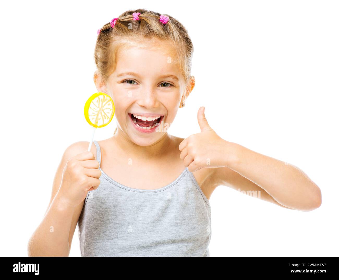 Adorable little girl with yellow lemon lollipop isolated over white ...