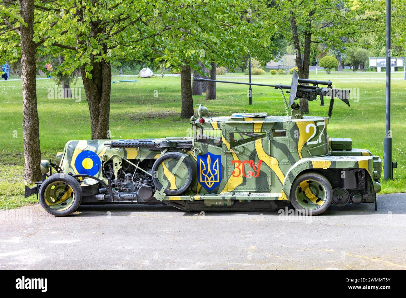 The armored car is stylized as an antique car, painted in camouflage ...