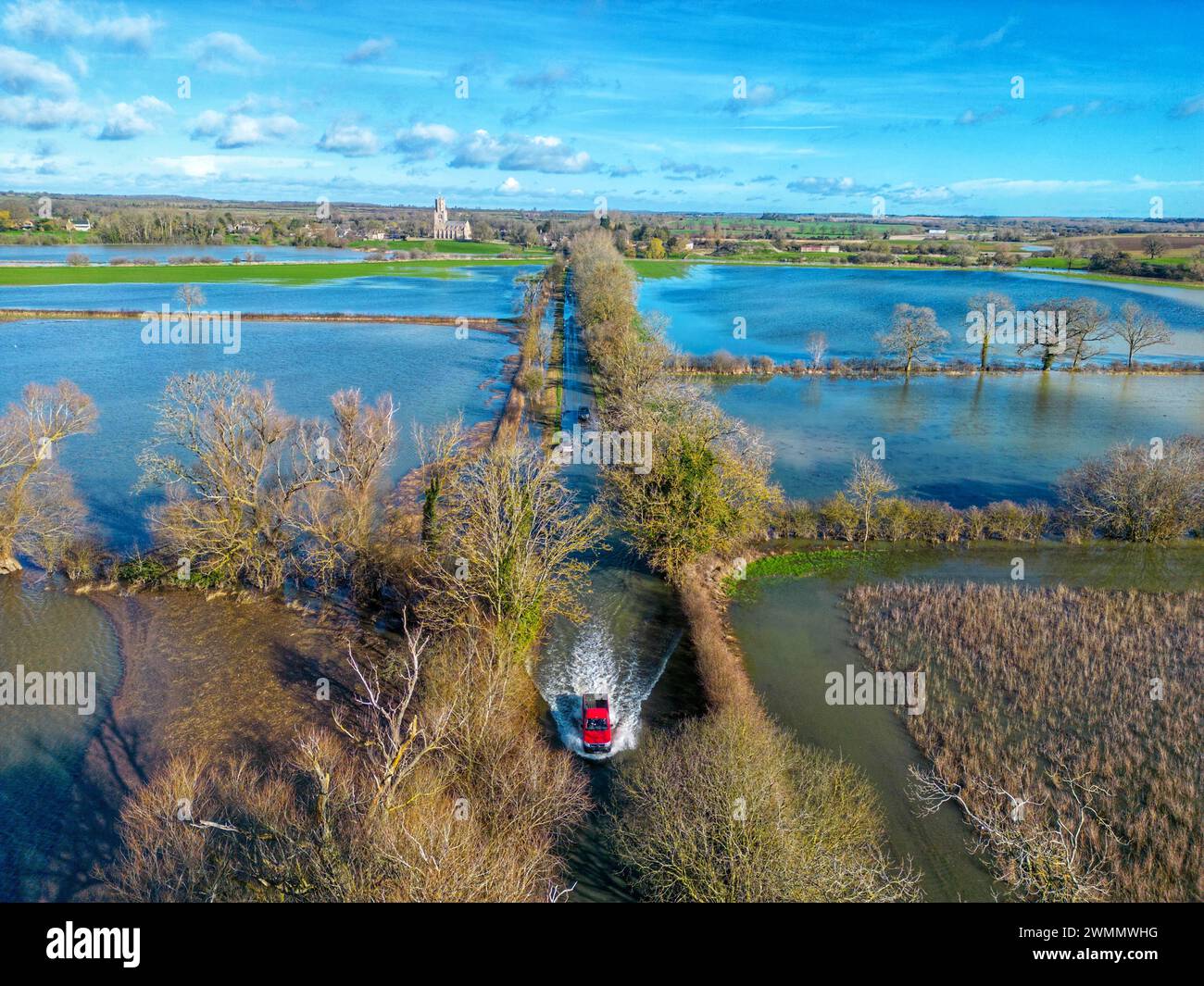 Vehicles make their way through floodwater at Fotheringhay, Northants ...