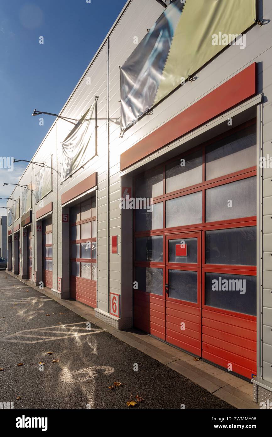 Building with a commercial vehicle repair shop with six garage doors ...