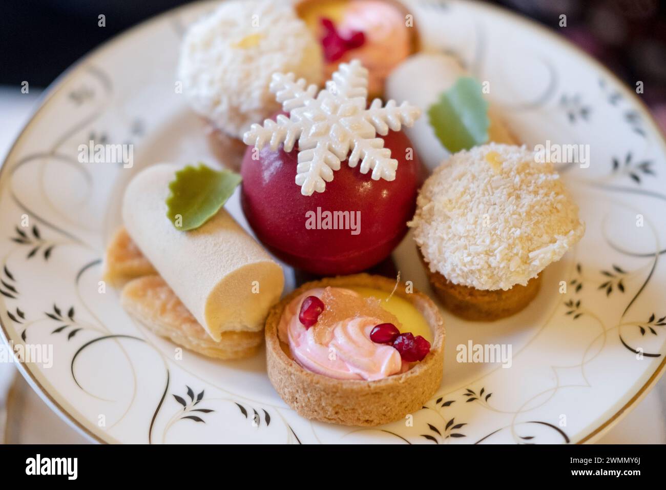 Assortment of bite-sized cakes such as fruit tartlets, cheesecakes ...