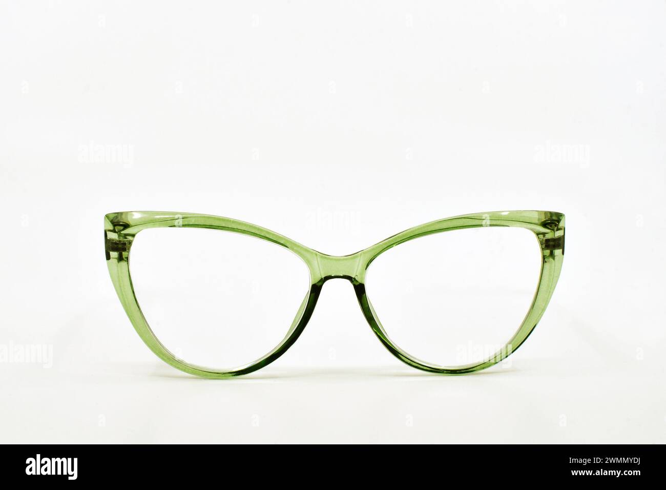Pair Of Cat Eye Shape Glasses With Green Frames Isolated On A Plain White Background Copy Space