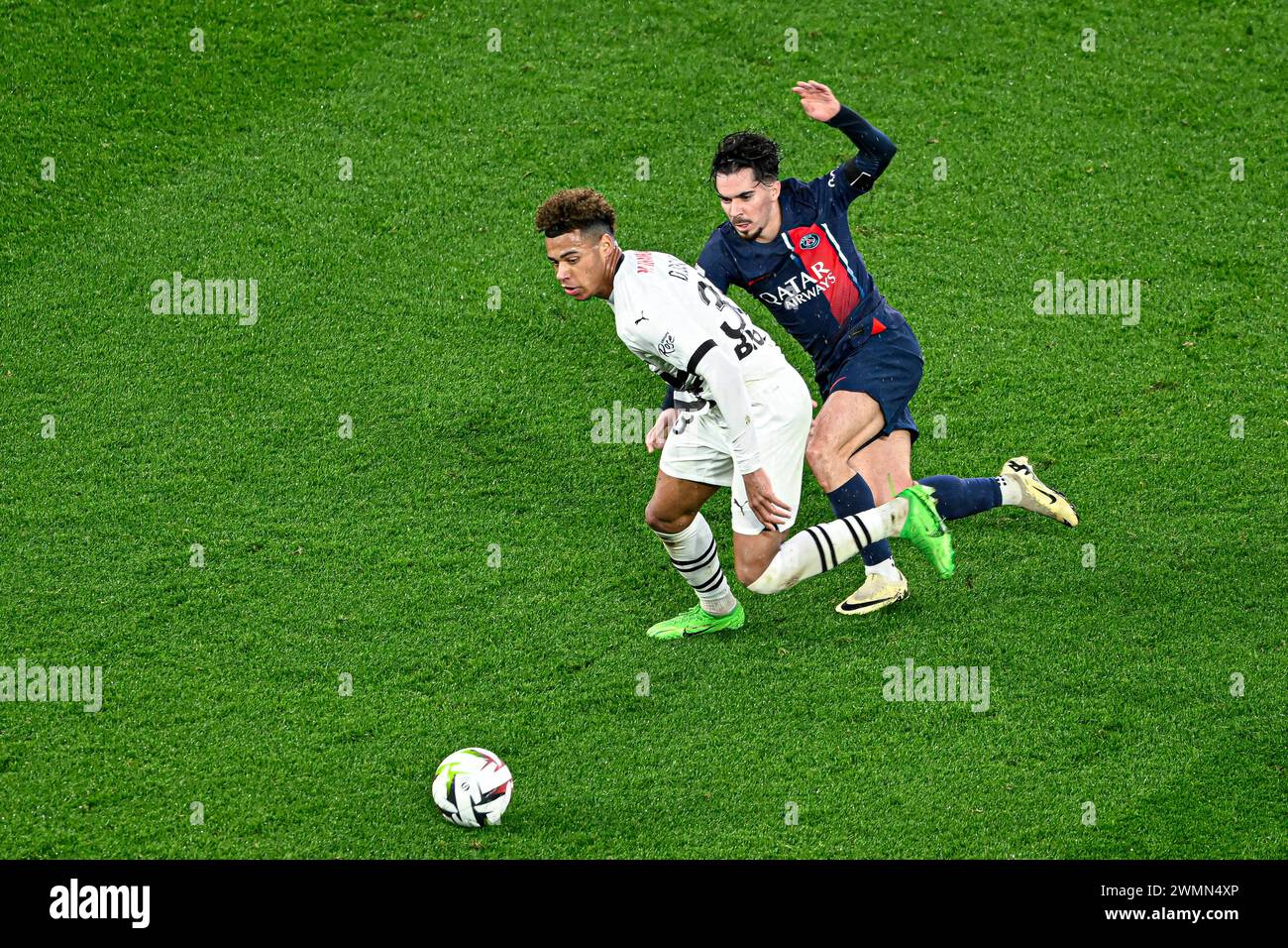 Paris, France. 25th Feb, 2024. Desire Doue and Vitor Machado Ferreira Vitinha during the Ligue 1 ...