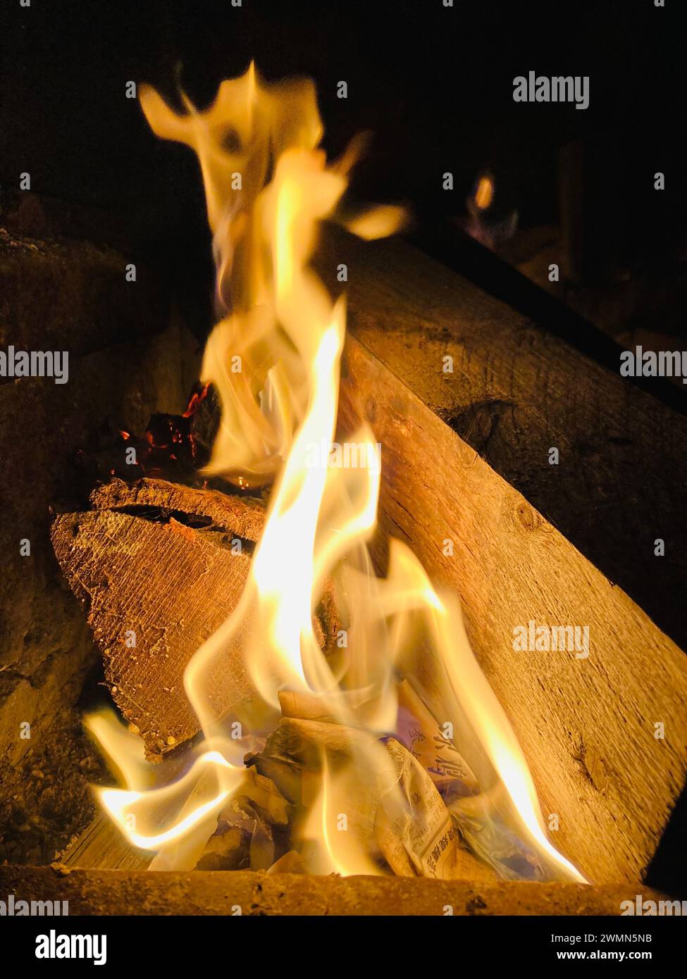 A nighttime fire burning brightly Stock Photo - Alamy