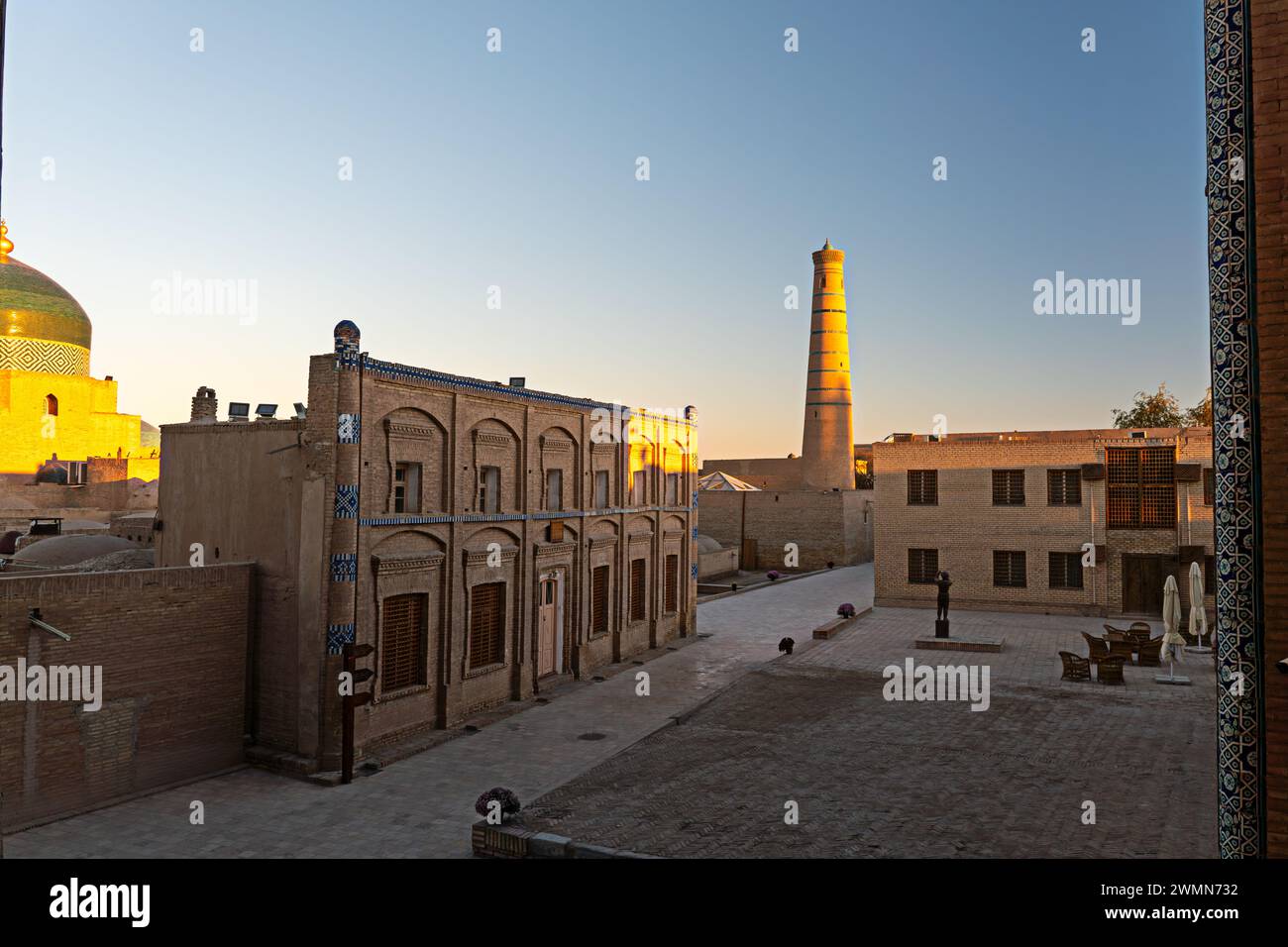 Juma mosque minaret in Khiva. Uzbekistan. an empty street of an ancient medieval city Itchan ...