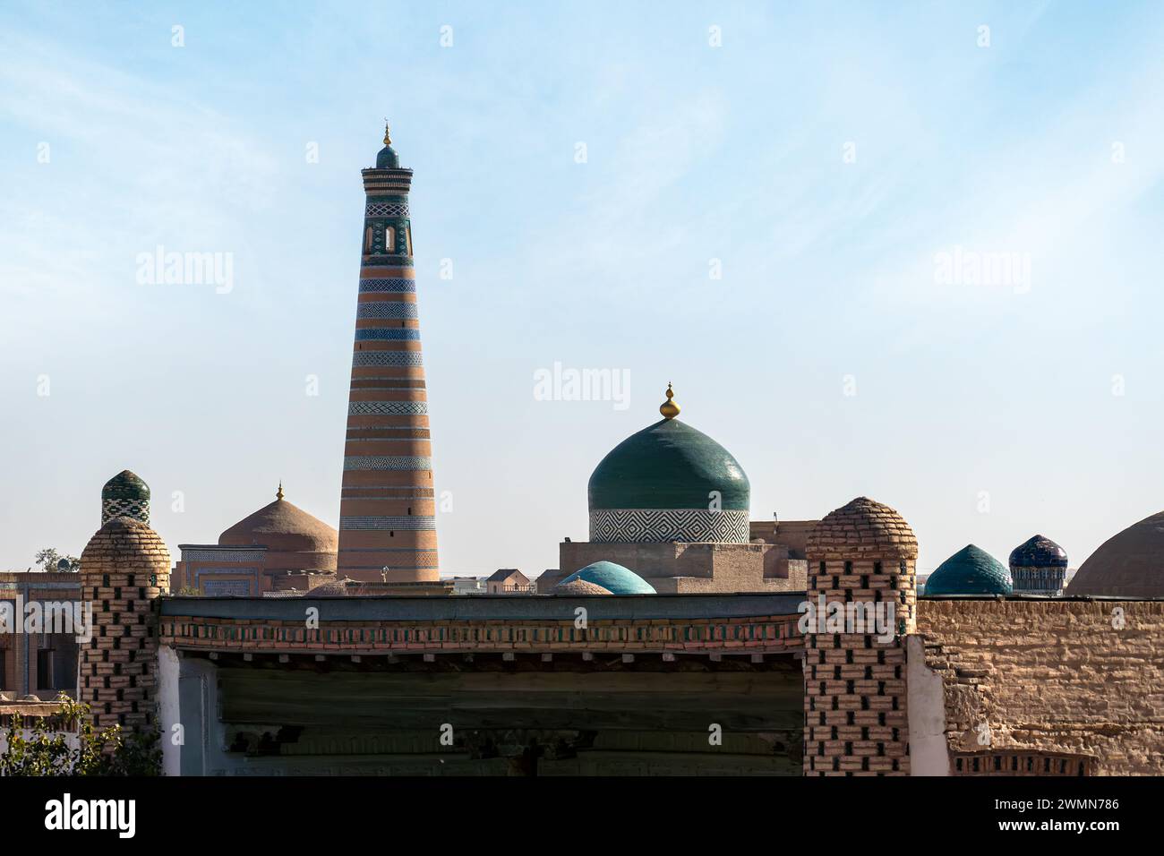 Two of main attractions of Khiva (Uzbekistan): Islam Khodja minaret and ...