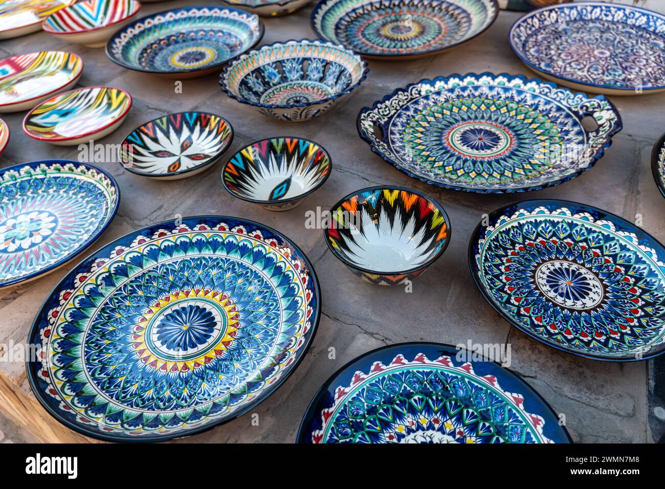 ancient city of Bukhara market of ceramic tableware. The blue plate is ...