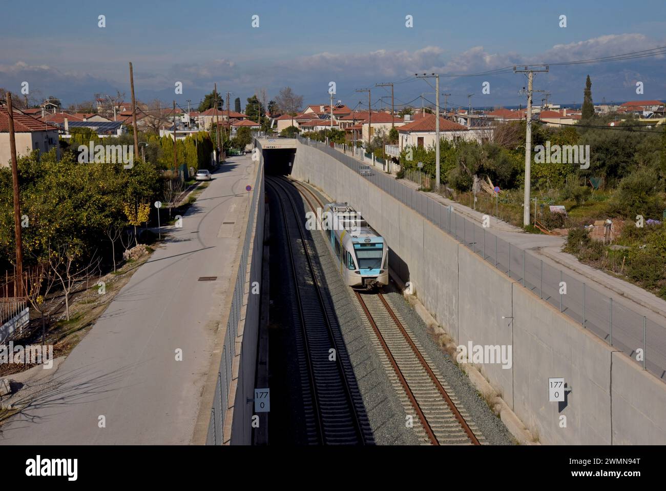 A diesel railcar of the OSE Greek railway arriving at the main station ...