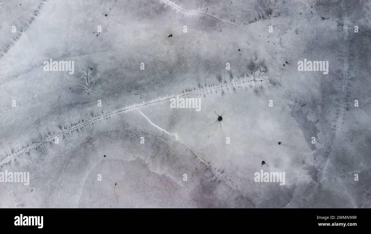 Frozen lake from above, ice structure. Winter pranks Stock Photo - Alamy