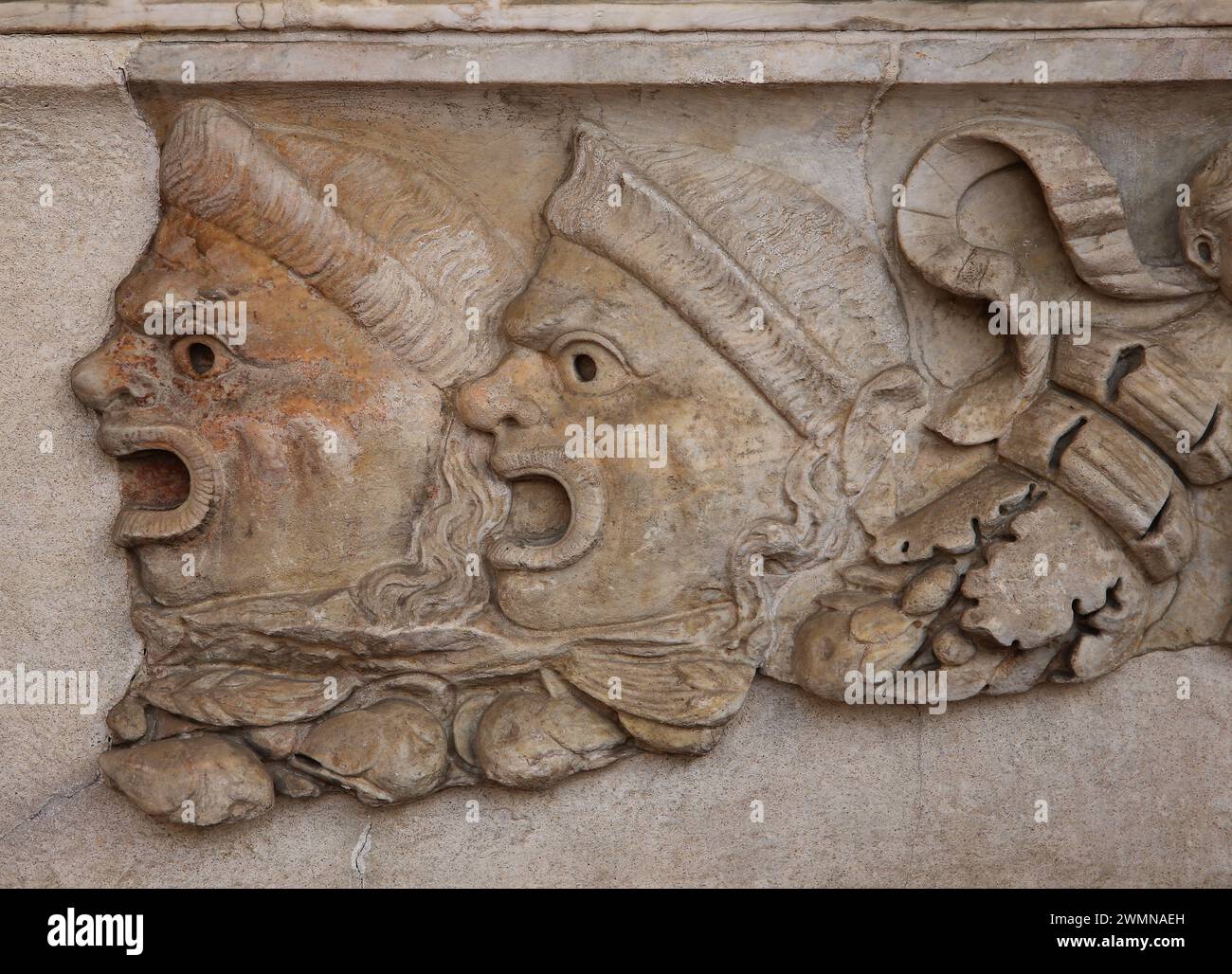Sarcophagus decoretated with garlands, cupid and theatrical masks. Lid ...
